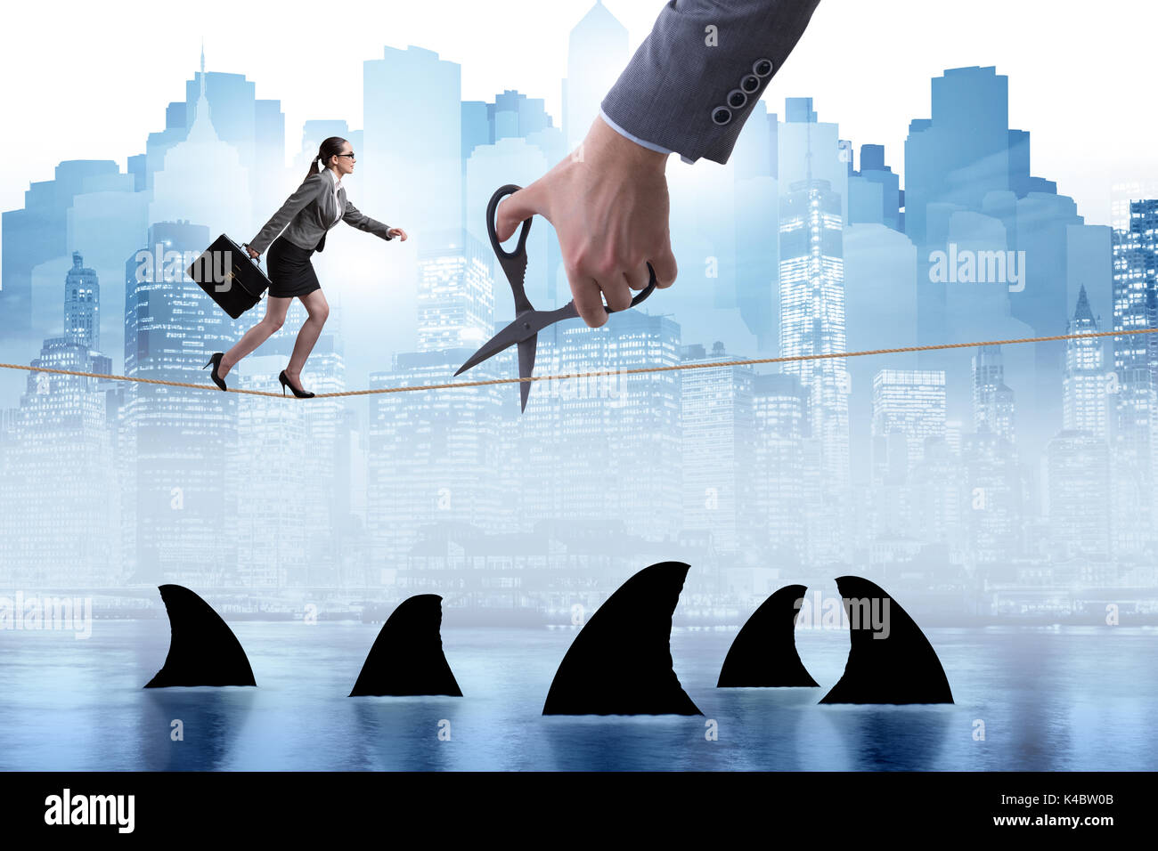 Hand cutting rope in business risk concept Stock Photo - Alamy