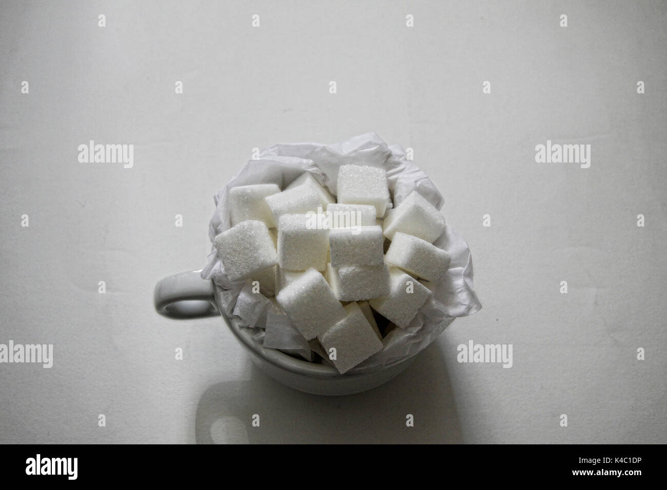 Sugar cubes eat High Resolution Stock Photography and Images - Alamy