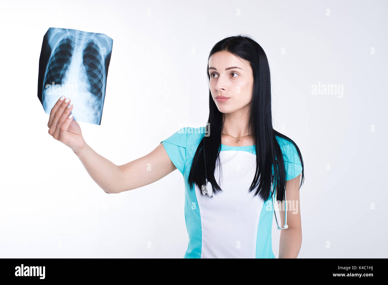 Female doctor or nurse looking at radiography photo Stock Photo - Alamy