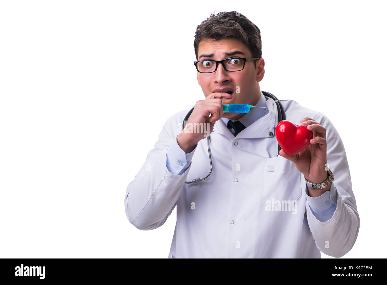 Young male cardiologist doctor holding a heart isolated on white ...