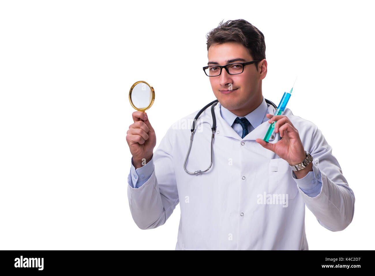 Young doctor with a magnifying glass and a syringe isolated on white ...