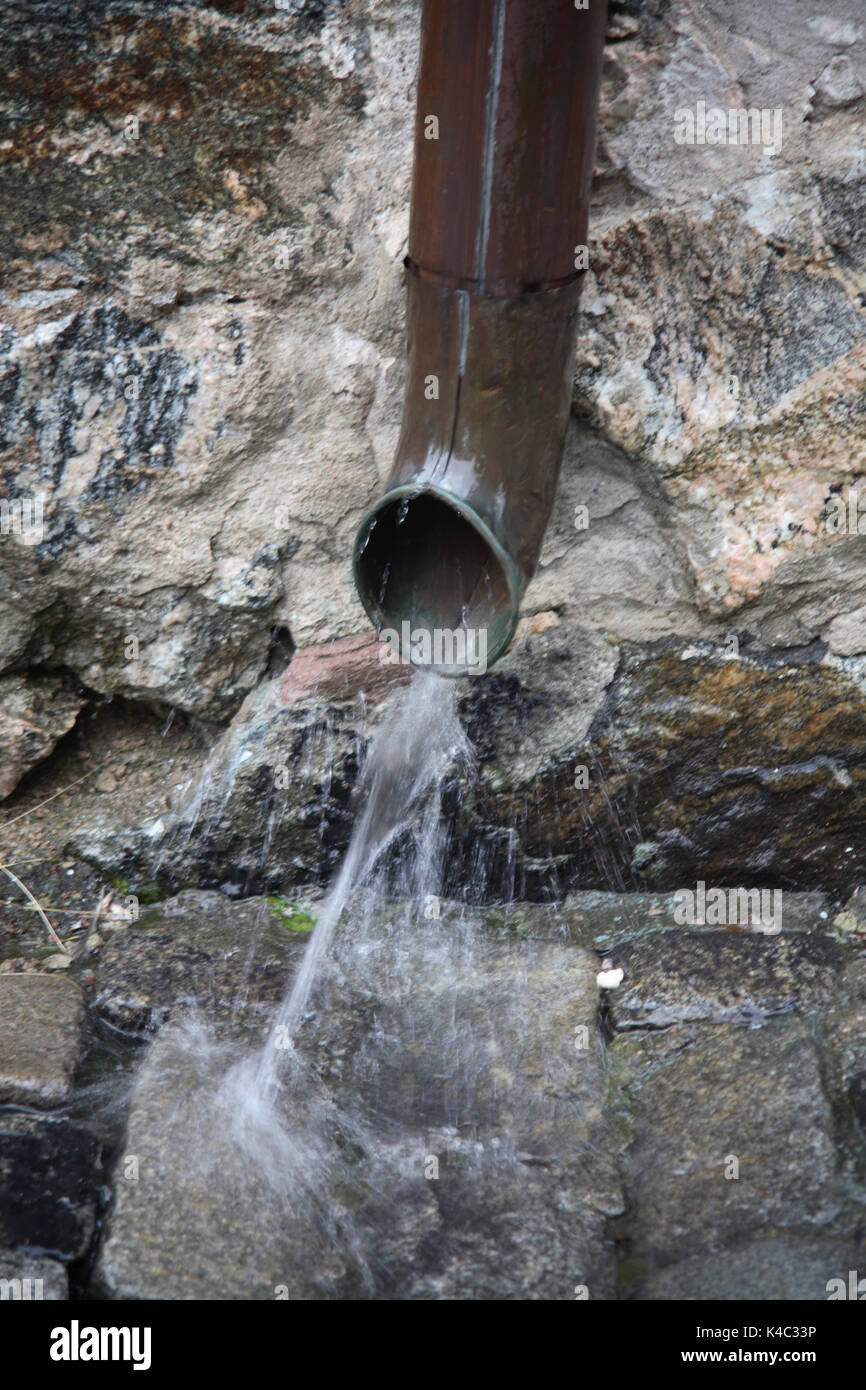 RAIN WATER rains out of the pipe 2007 Stock Photo - Alamy