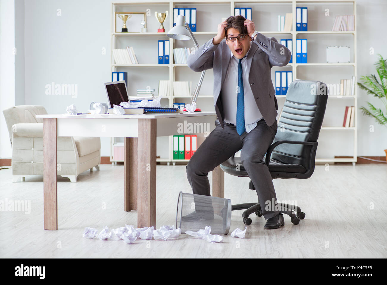 Angry businessman shocked working in the office fired sacked Stock ...