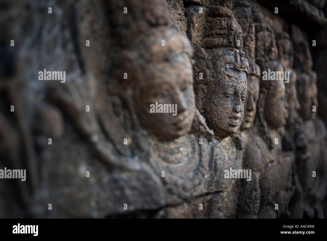 Buddhist stone carvings at the Borobudur temple in Java, Indonesia ...