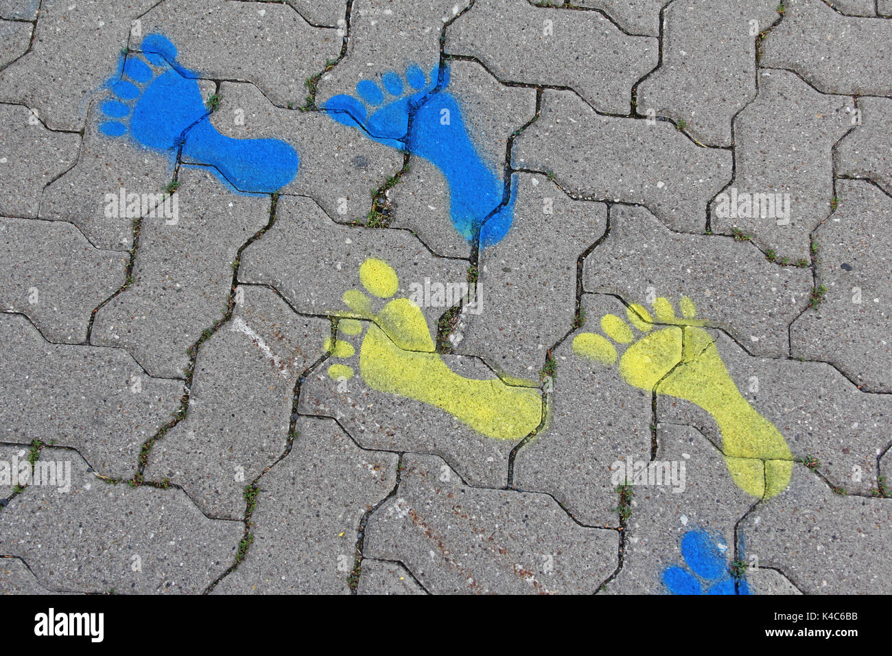 Colored Footprints On Walkway Stock Photo - Alamy