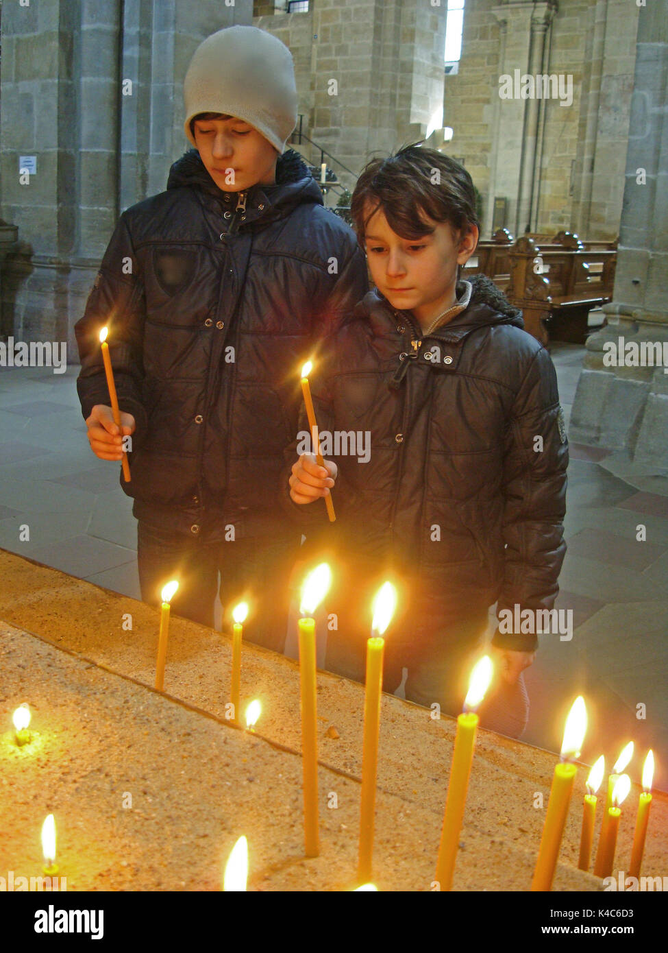 Children With Candles In The Church Stock Photo - Alamy