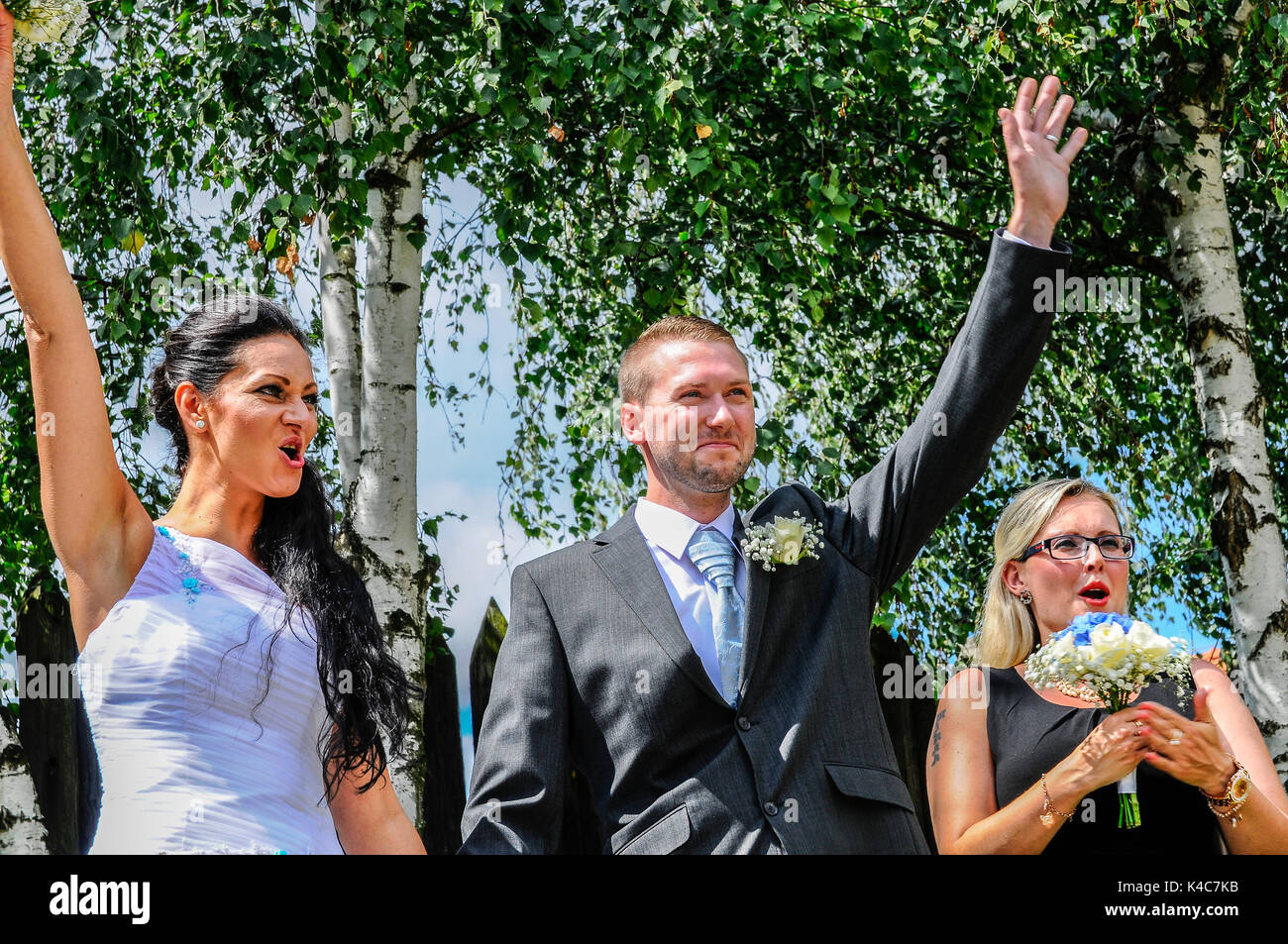 beautiful white married couple in wedding and summer day give a living ...