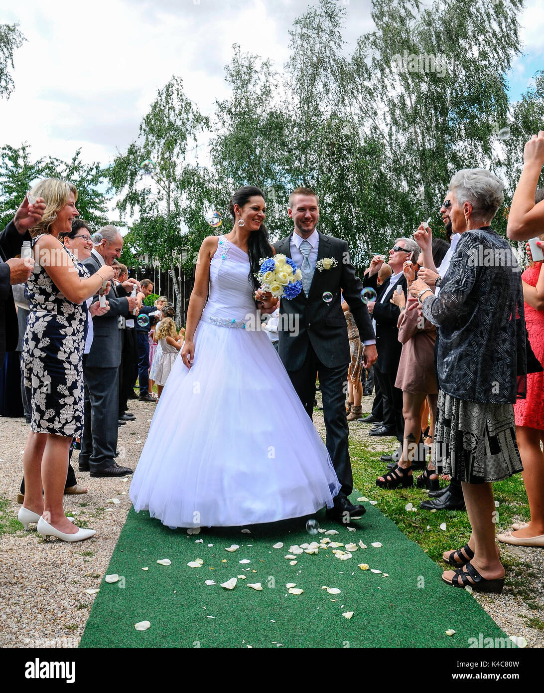 beautiful white married couple in wedding and summer day give a living ...