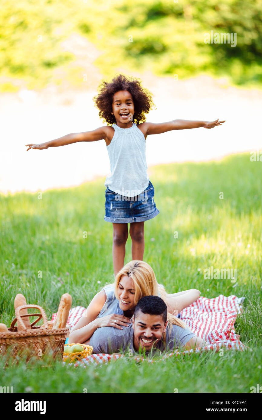 Happy family having fun time on picnic Stock Photo - Alamy