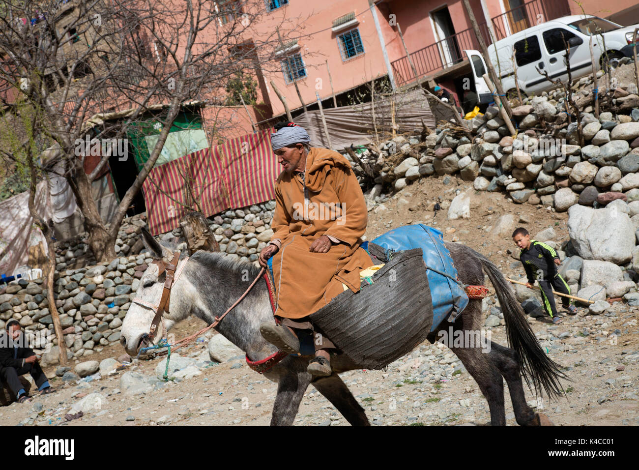Berber man riding a donkey at Setti Fatma souk, Ourika Valley, Atlas ...