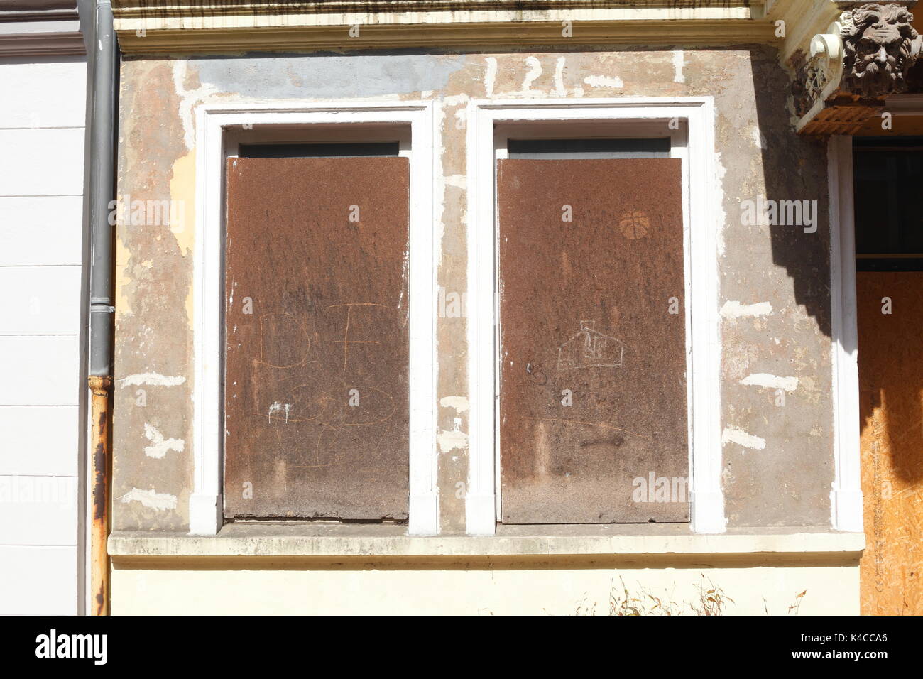 barricaded old windows on an old house Stock Photo - Alamy