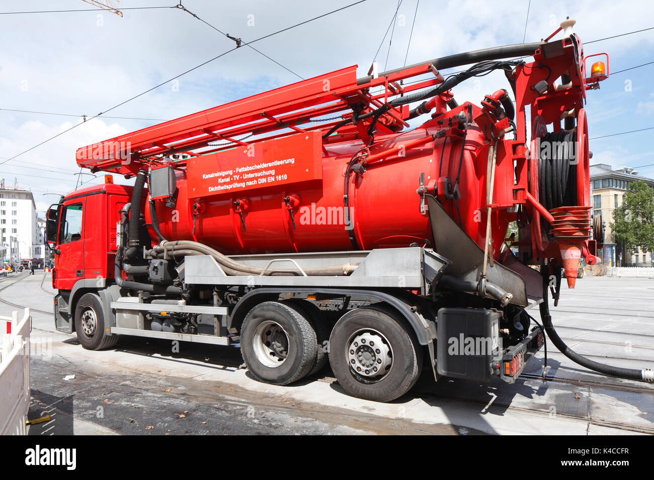 red special vehicle for canal cleaning with water tank Stock Photo - Alamy