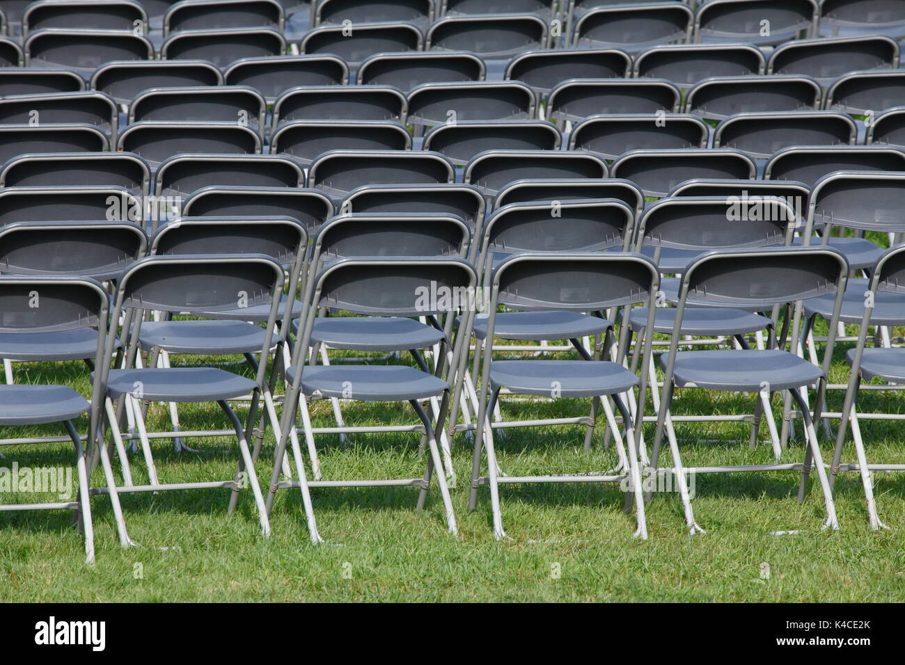 plastic chairs, grey chair row on a festival Stock Photo - Alamy