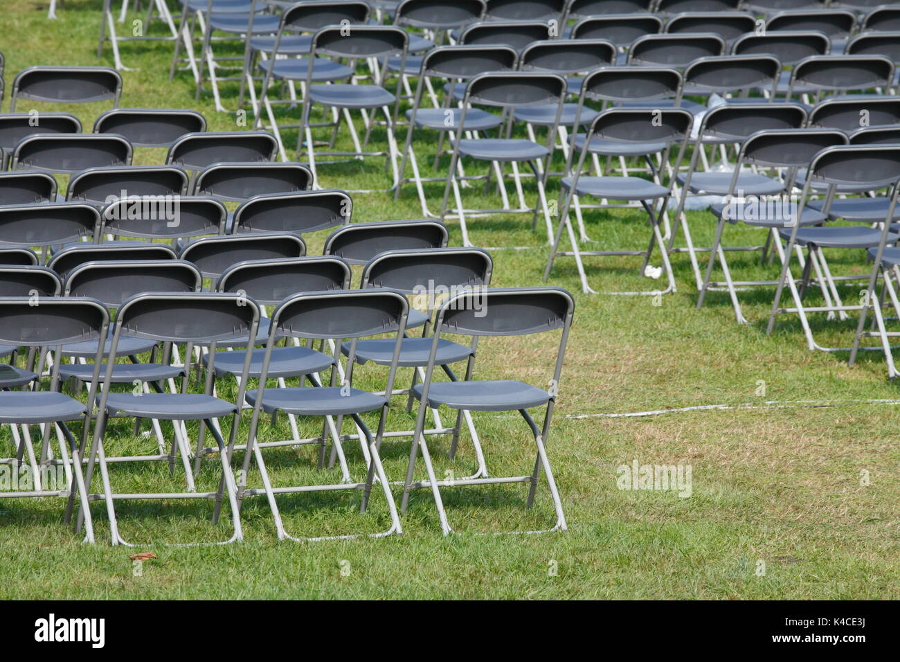 plastic chairs, grey chair row on a festival Stock Photo - Alamy