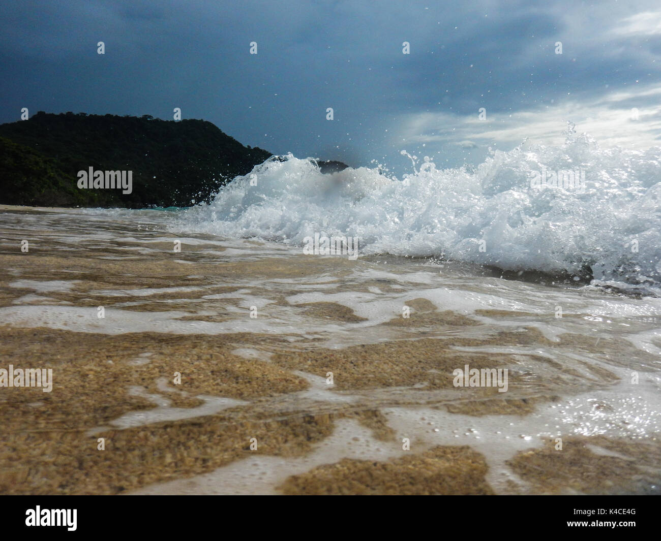 Stormy Atmosphere, Wave Breaking On The Beach, Draining Water On Sandy ...