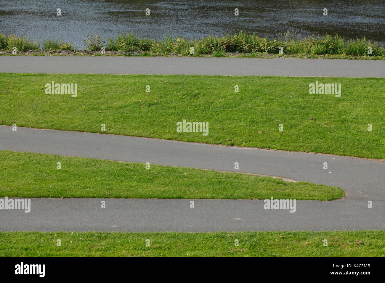 Walk in a Park with lawn Stock Photo - Alamy