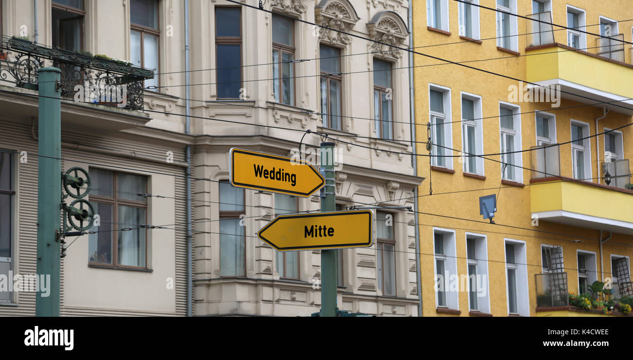 two yellow road signs with the arrow and the indications of the most ...
