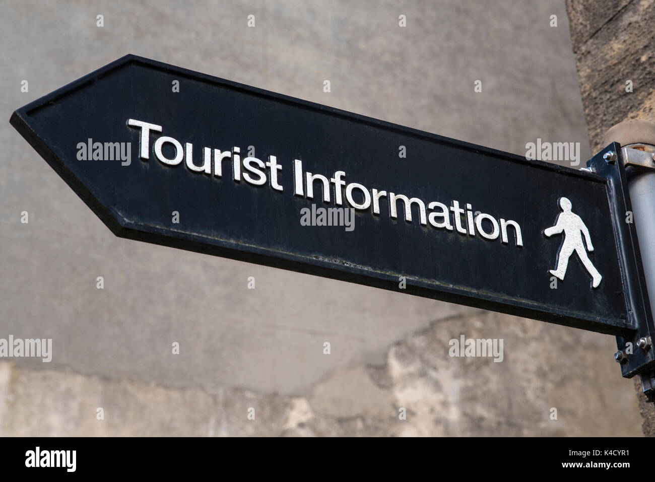 A sign showing the direction to a tourist information Stock Photo - Alamy