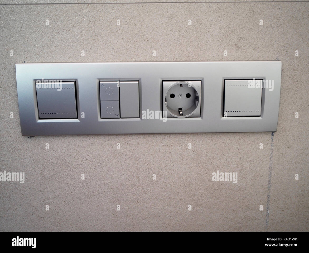 Plug and switch in the wall Stock Photo - Alamy