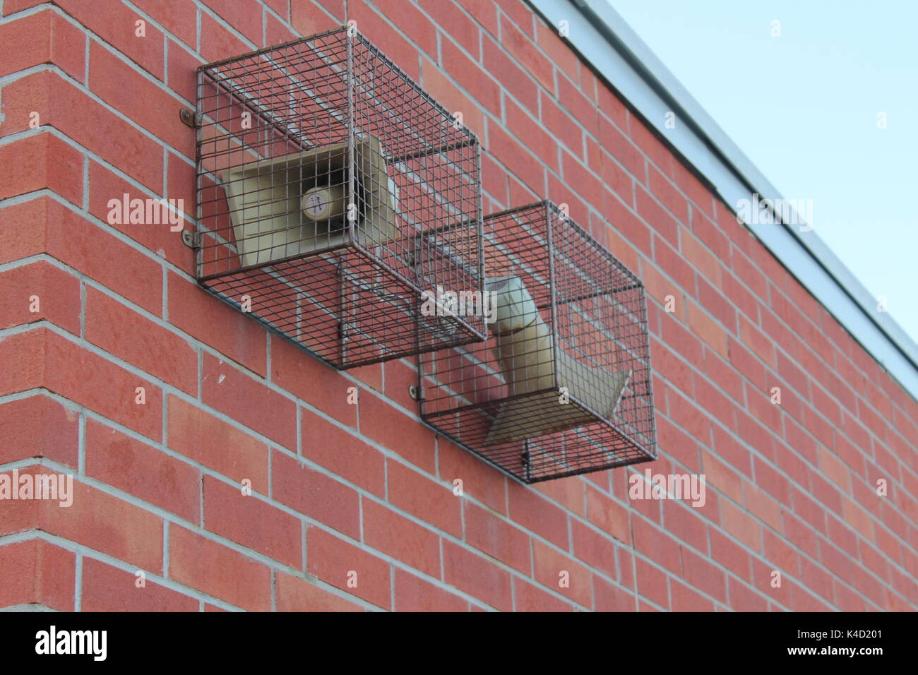 School PA system and red brick background Stock Photo - Alamy