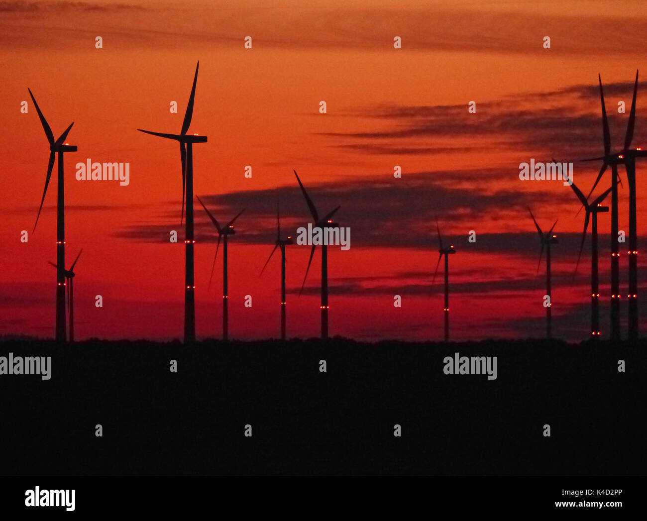 Sunset With Wind Wheels On The Horizon Stock Photo - Alamy