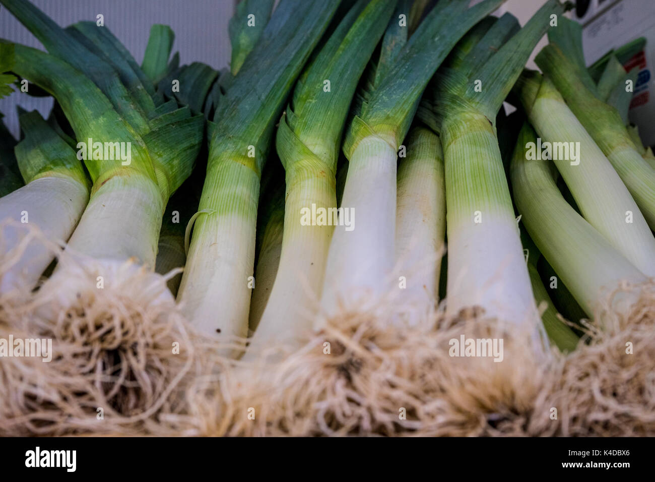 Leeks and green vegetables at farmers market hi-res stock photography ...