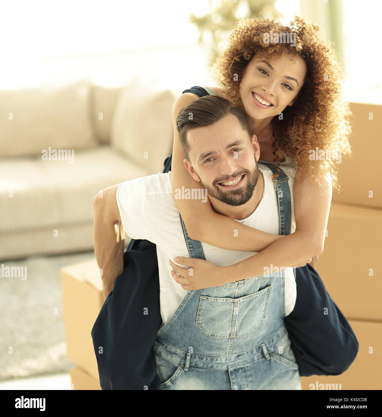 Portrait of a couple in love in a new empty apartment Stock Photo - Alamy