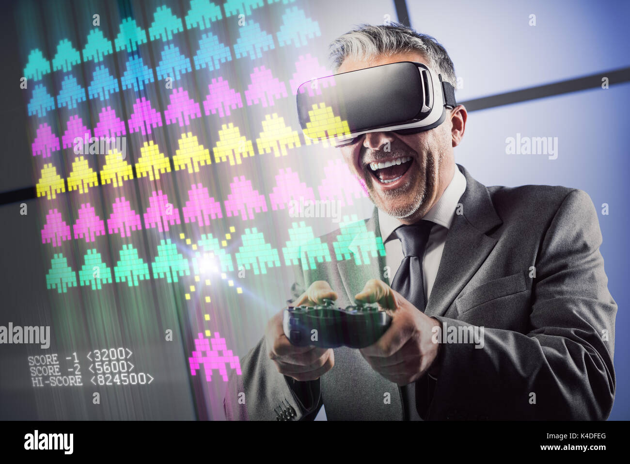 Businessman enjoying virtual reality gaming, he is wearing a VR headset ...