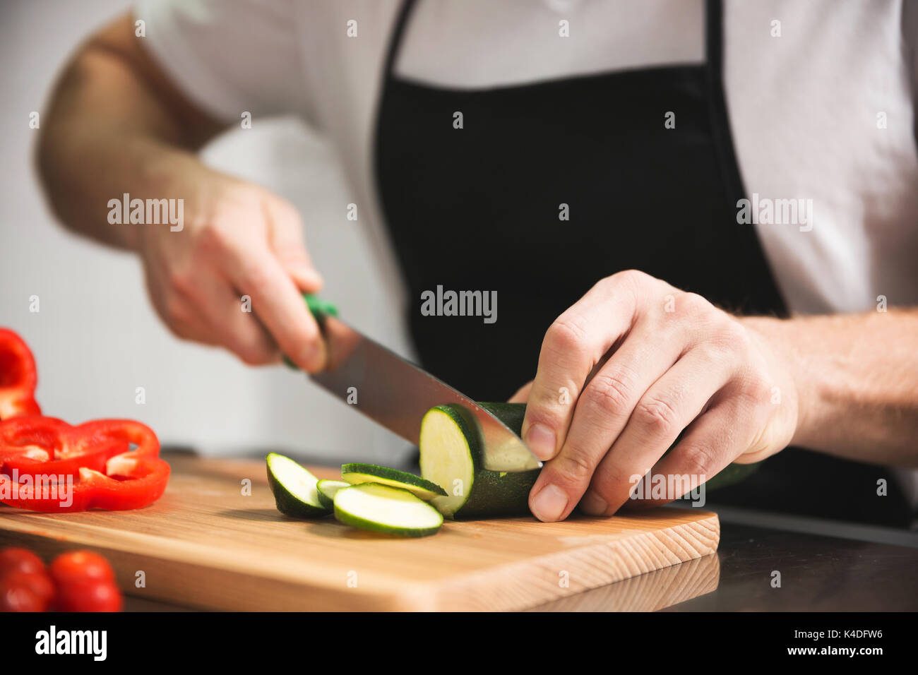 Close up portrait of chef hands cutting vegetables Stock Photo - Alamy