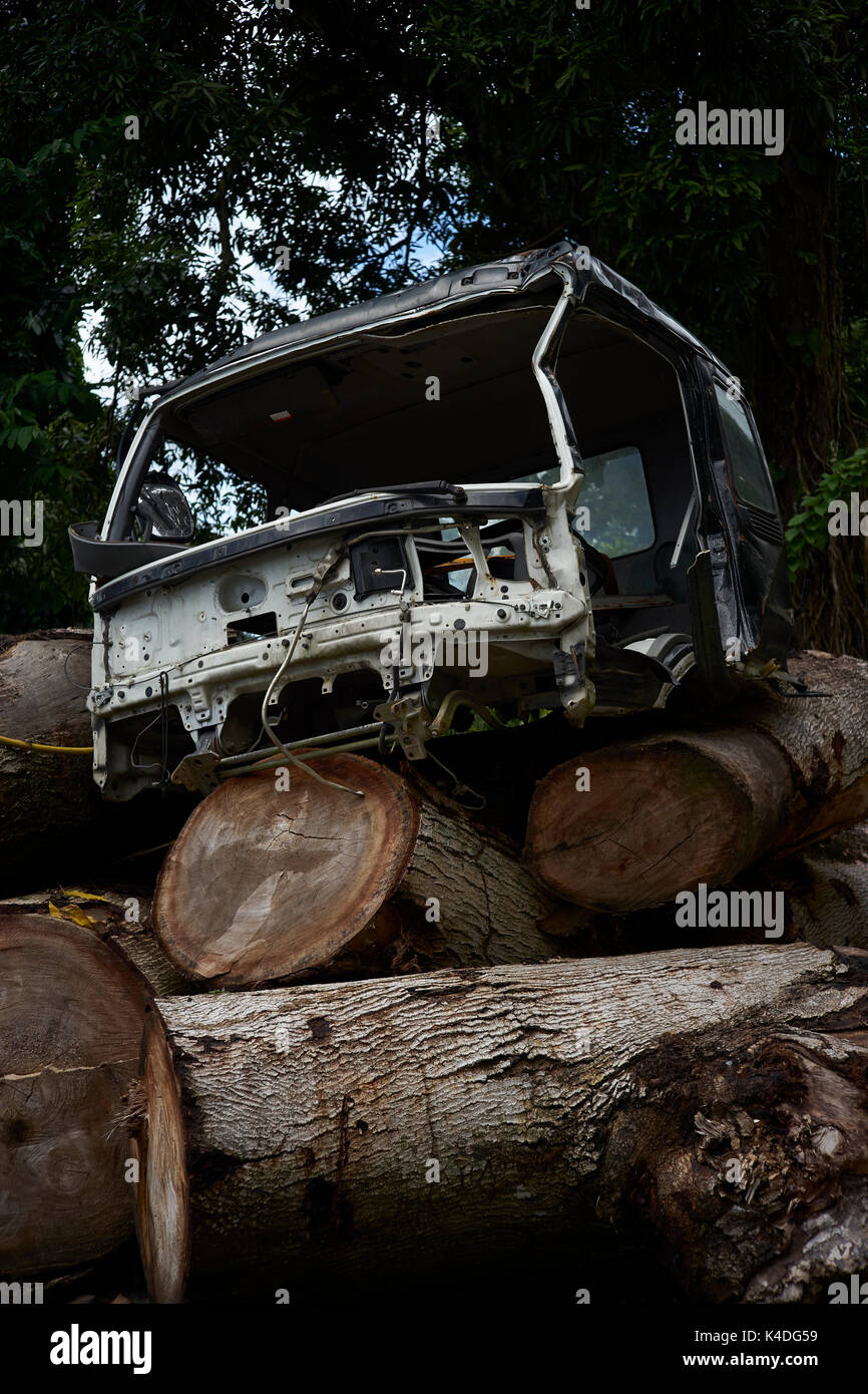 Scrapped truck chassis placed on thick wooden trunks Stock Photo - Alamy