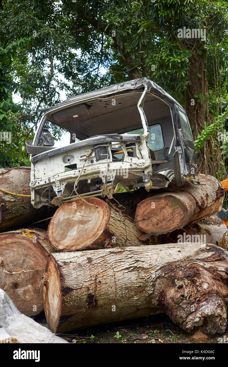 Scrapped truck chassis placed on thick wooden trunks Stock Photo - Alamy