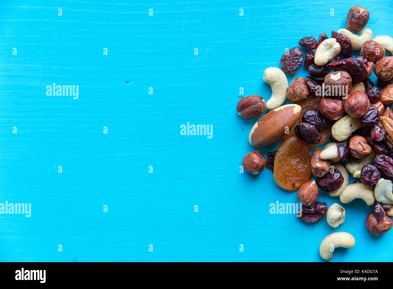 Healthy quick snack in office. Dry fruits and nuts on desk Stock Photo ...