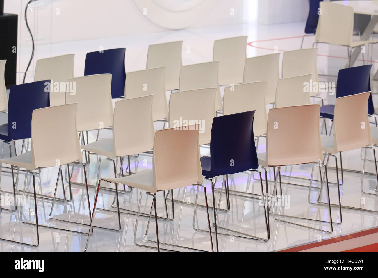 Conference chairs aligned in a row on a podium Stock Photo - Alamy