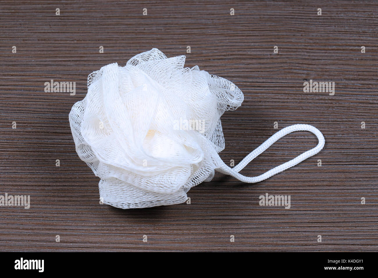White bath sponge for exfoliating skin while taking a shower Stock ...