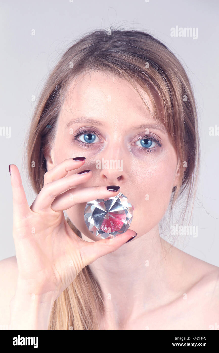 Young girl with sparkling diamond inside her mouth Stock Photo - Alamy