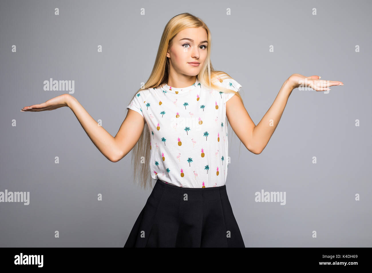 Happy smiling woman gesturing with hands and showing balance Stock ...
