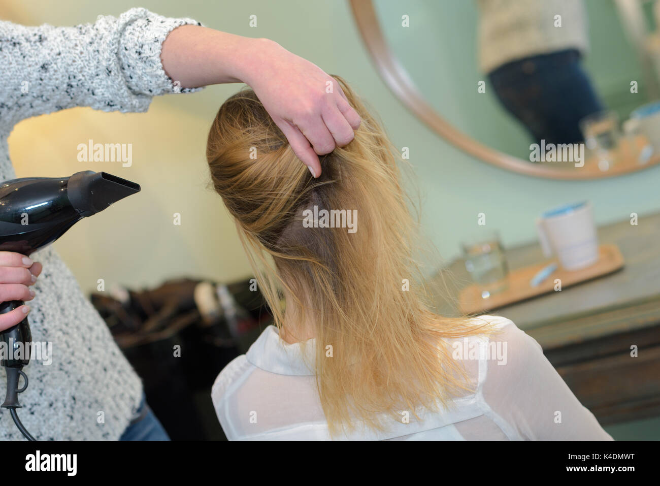 Professional hairdresser drying hair hi-res stock photography and ...