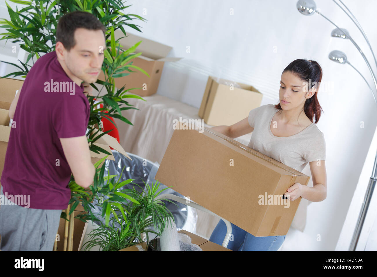 young couple moving in new house Stock Photo - Alamy