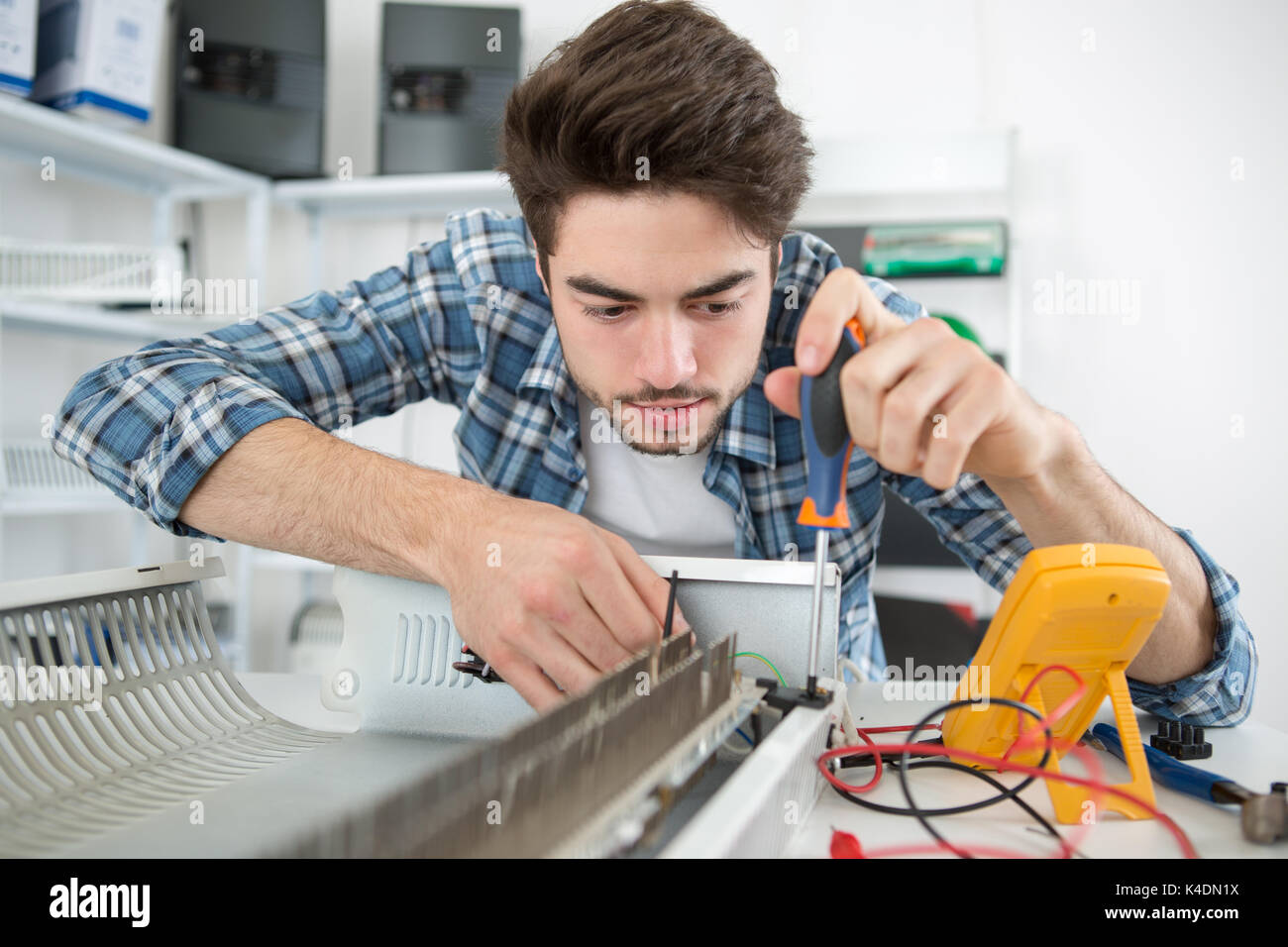 finding the defective part of an appliance Stock Photo - Alamy