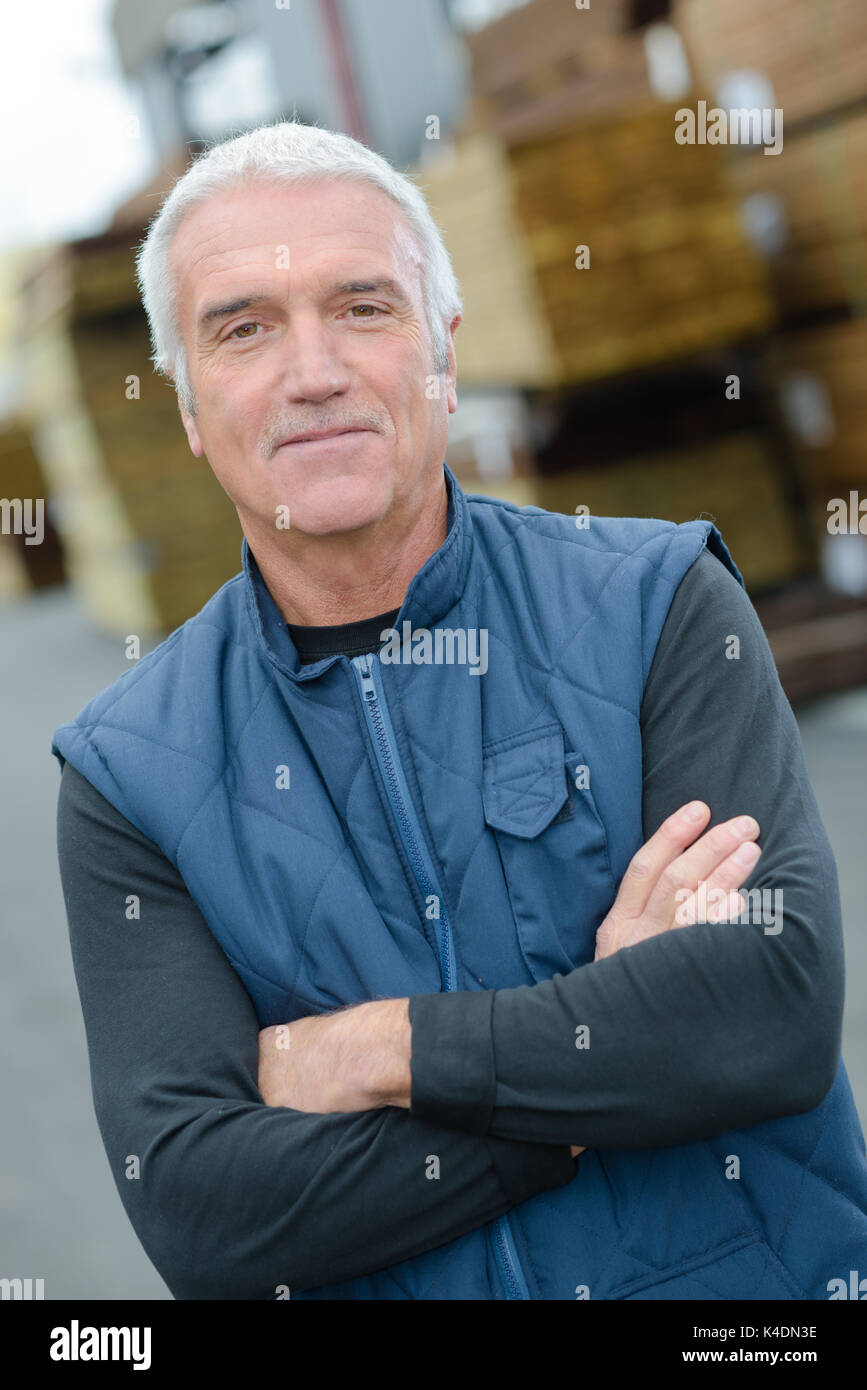 Portrait of middle aged worker outdoors Stock Photo - Alamy
