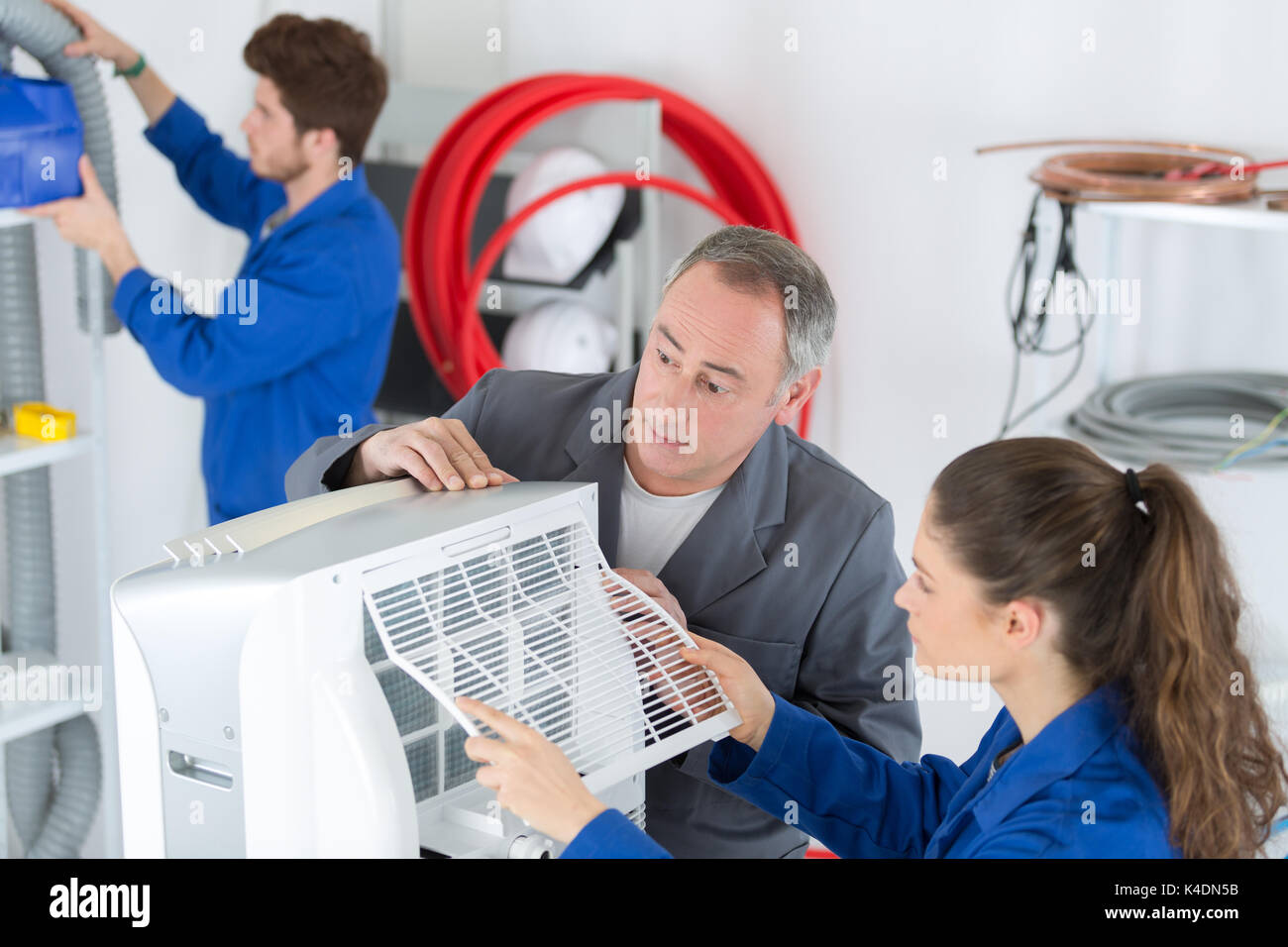 technicians repairing an industrial air conditioning compressor Stock ...