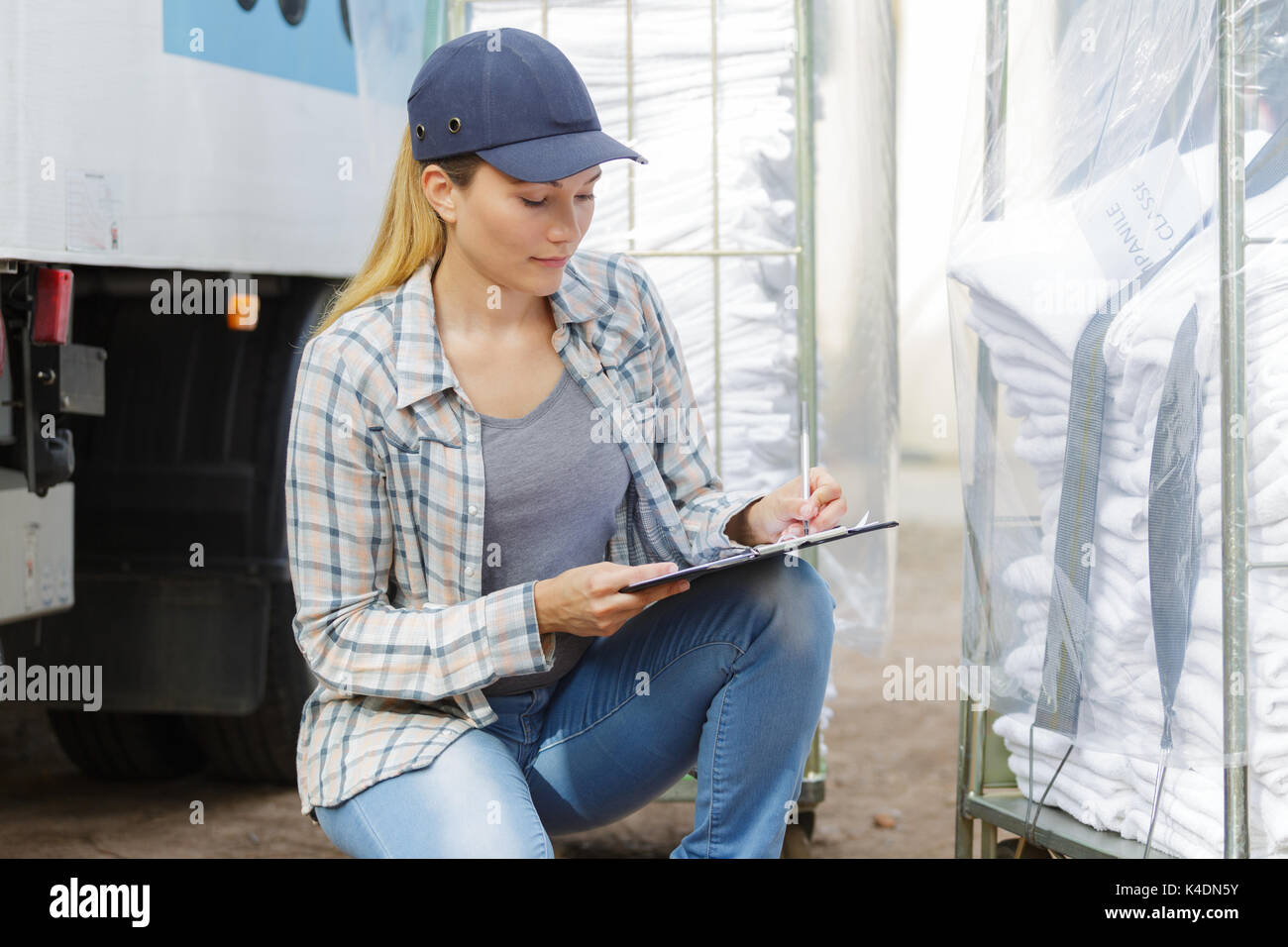 female worker in distribution warehouse Stock Photo - Alamy