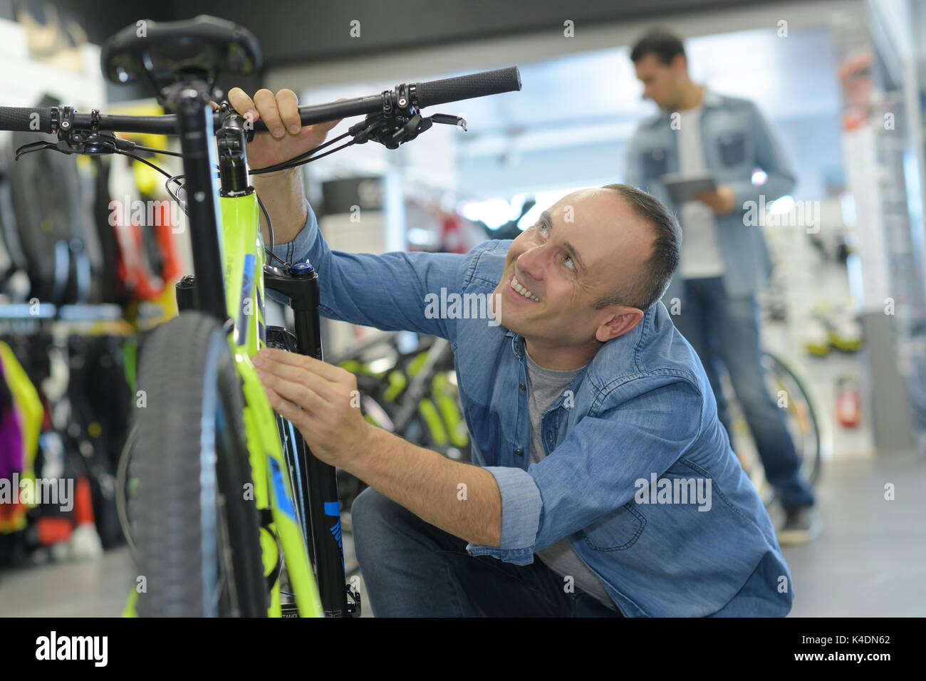 Man choosing bike hi-res stock photography and images - Alamy