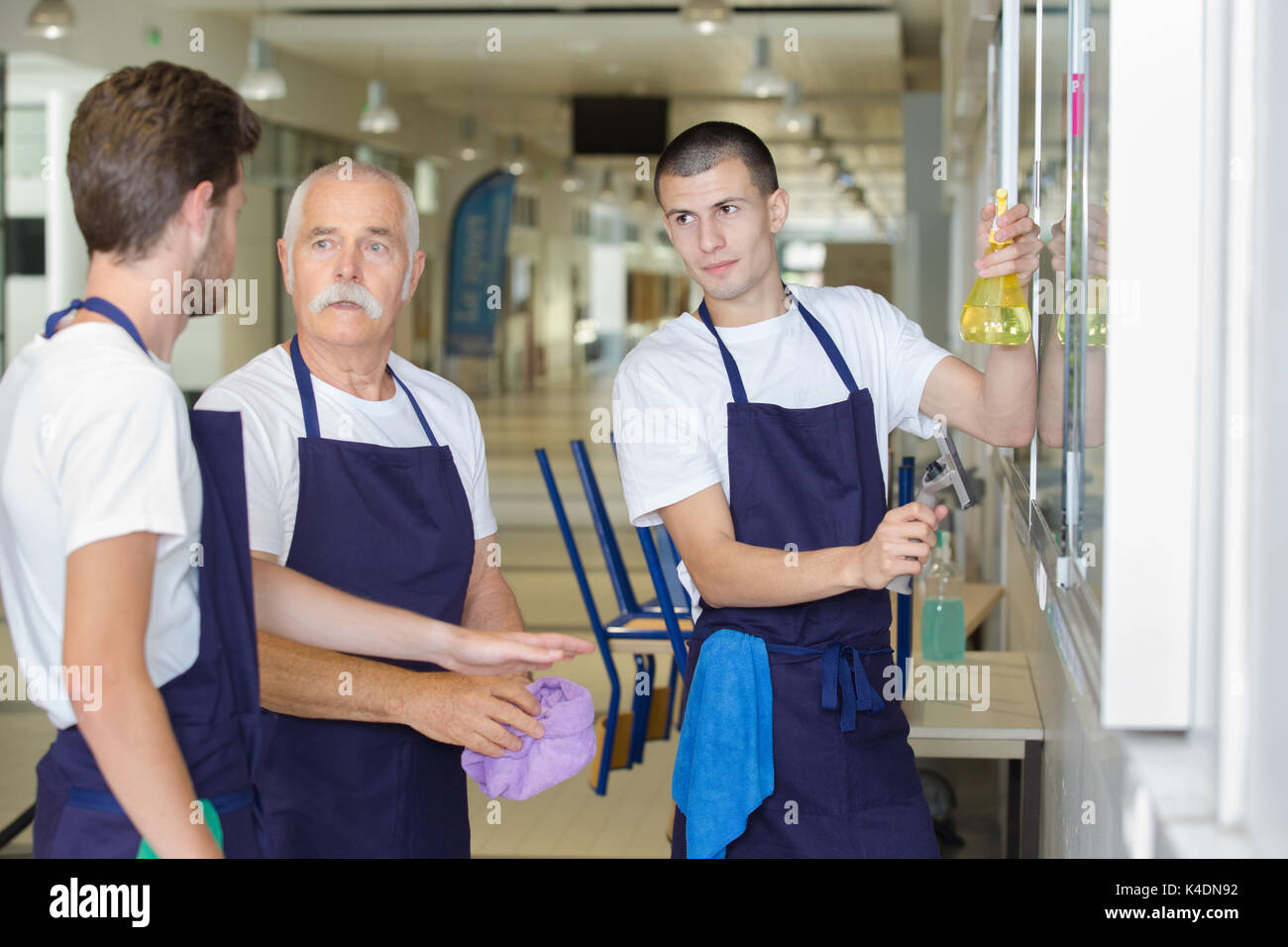 Male cleaning team at work Stock Photo - Alamy