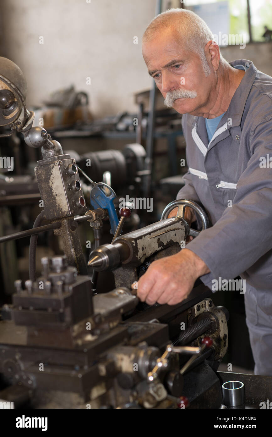 senior technician repairing and checking the engine Stock Photo - Alamy