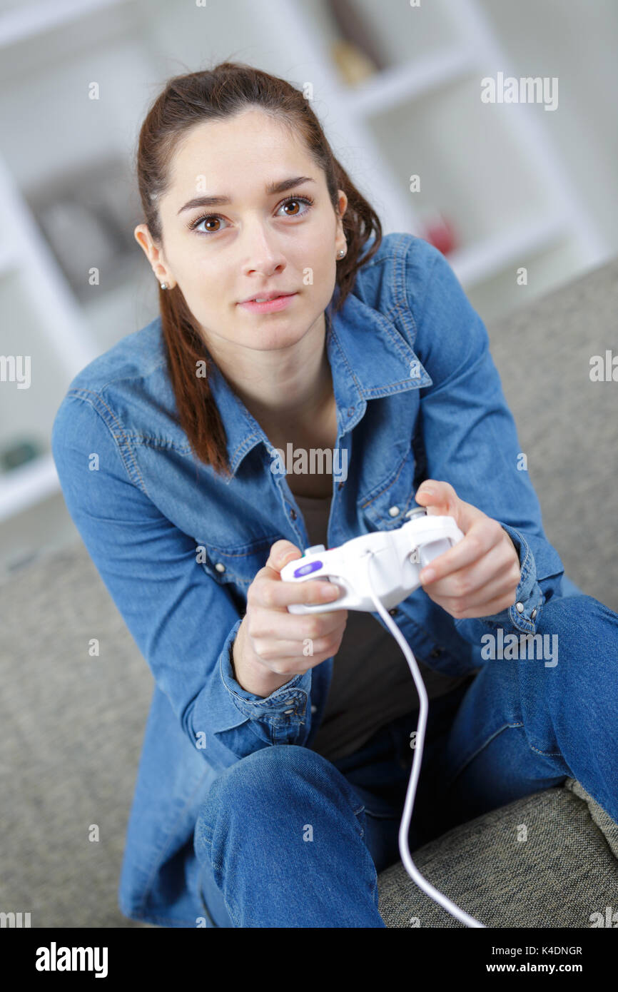 woman playing video game with controller Stock Photo - Alamy