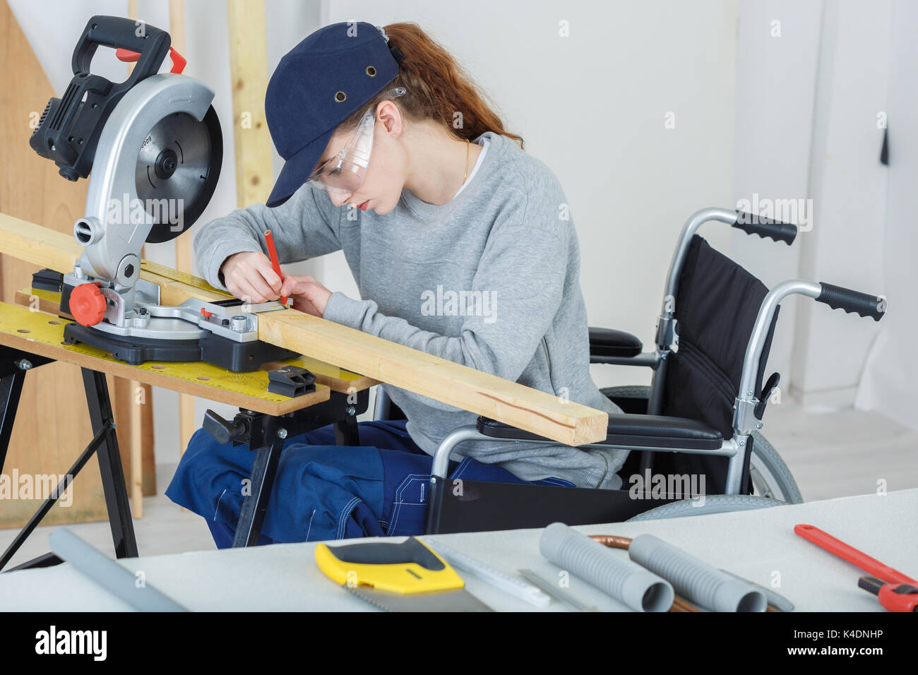 disabled female worker in wheelchair in a carpenters workshop Stock ...