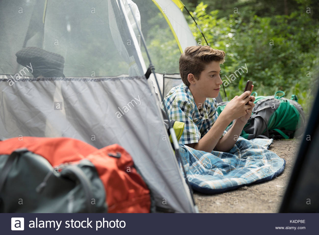 Boy child texting mobile cell phone hi-res stock photography and images ...