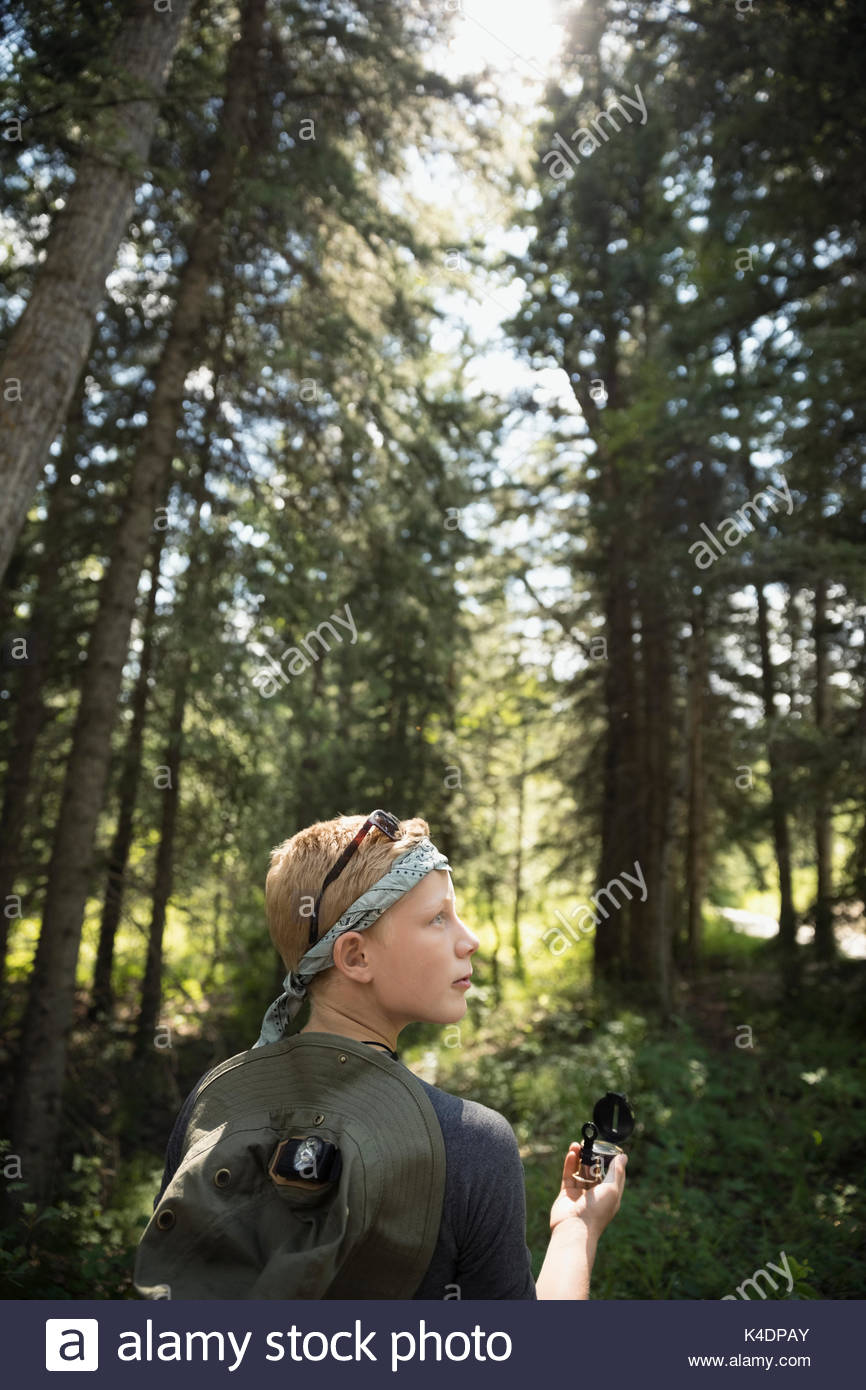 Boy using a compass hi-res stock photography and images - Alamy