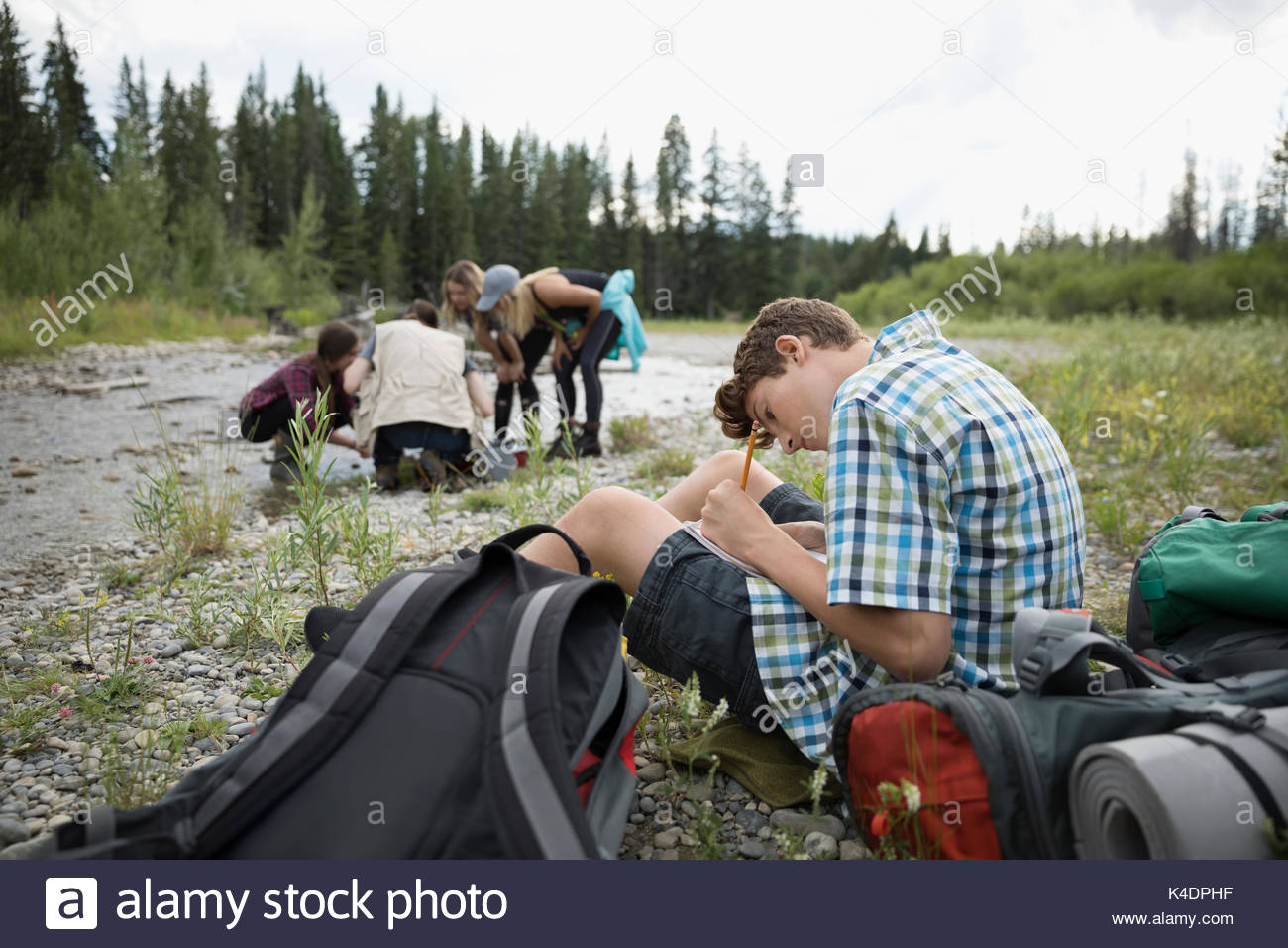 Boy writing notes hi-res stock photography and images - Alamy